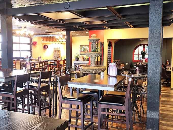 A stone fountain anchors the dining room, giving El Rey a charm that goes way beyond tacos.