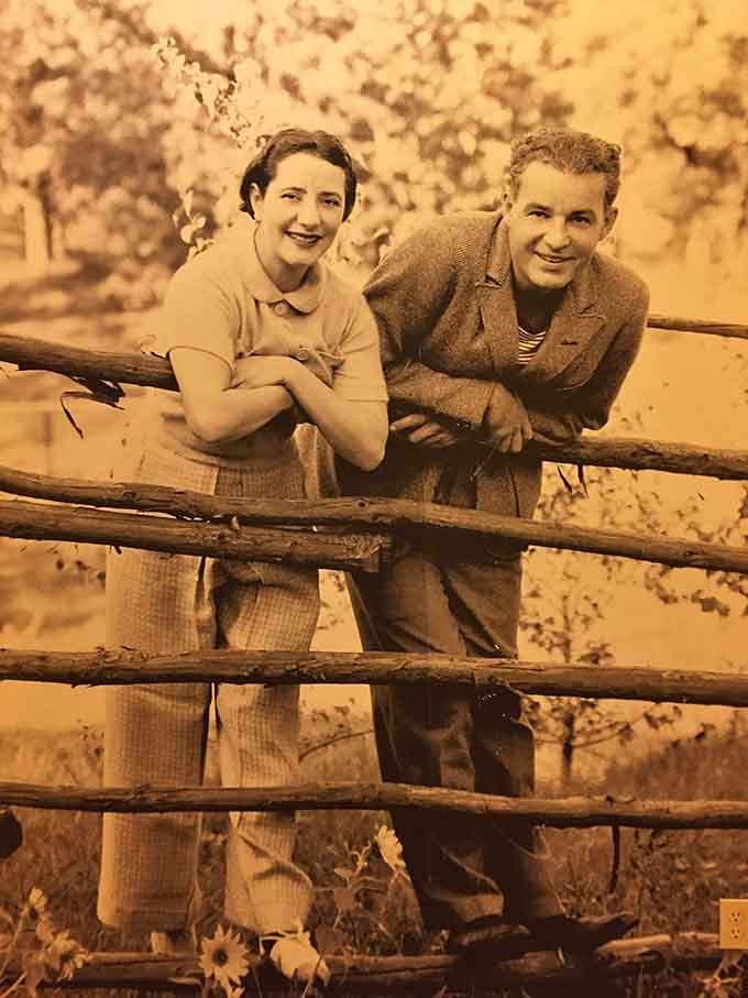Alfred Lunt and Lynn Fontanne lean on a fence, looking like two people who genuinely loved their life.