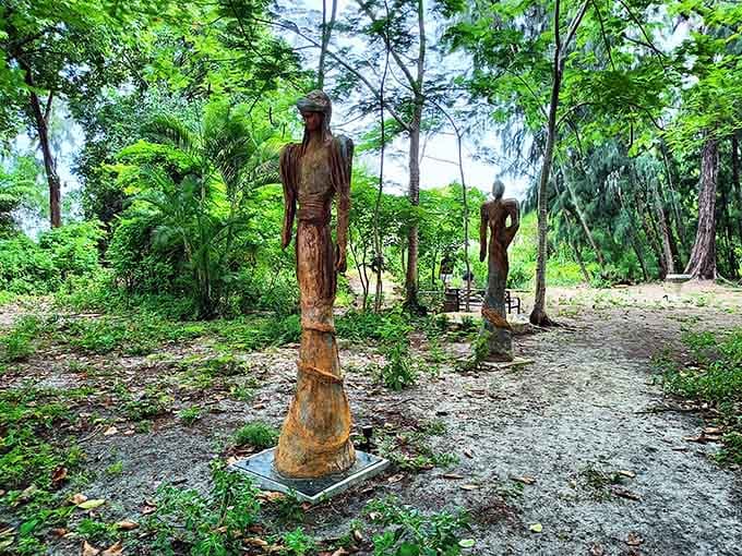Weathered figures standing quietly among the trees, like they've been waiting patiently for someone to finally notice them.