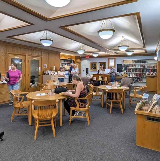 Community tables where locals gather, proving libraries remain the original social network, no wifi required.