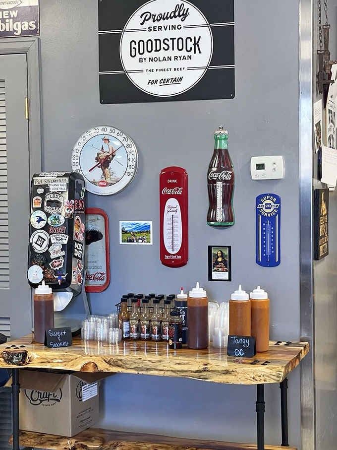 House sauces labeled Sweet and Smoky alongside Tangy OG. Goodstock beef on the wall seals the deal.