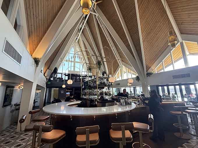 That circular bar under the A-frame ceiling is the kind of spot you find and never want to leave.