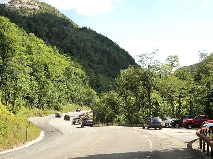Chapel Pond Pass squeezes the road between rock walls, reminding you that mountains set the rules around here.