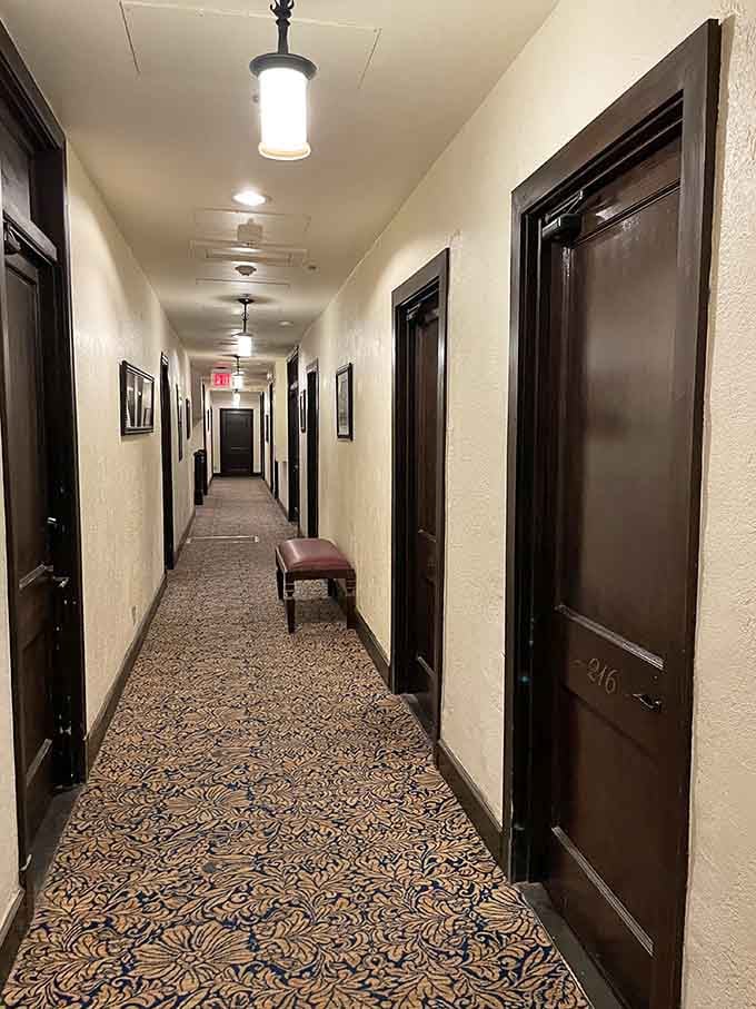 Long, quiet hallways lined with dark wooden doors and patterned carpet. History lives around every corner here.