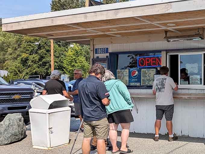 A line of happy people at the window is the oldest and most reliable restaurant review in existence.