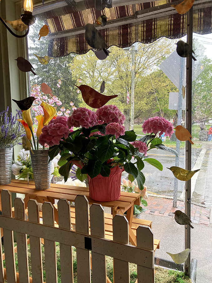 Window decorations featuring birds and blooms that add charm to an already irresistible chocolate destination.