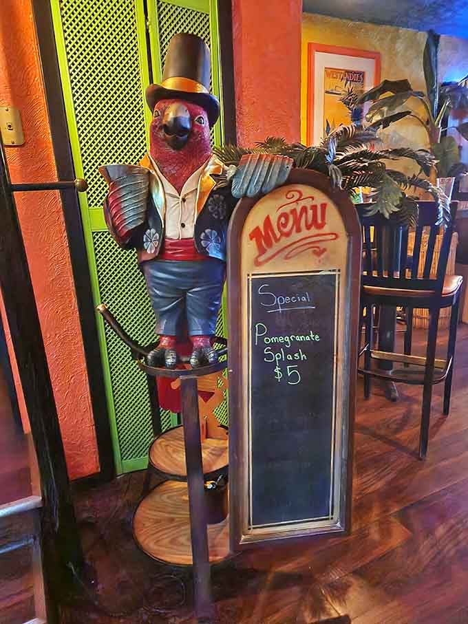 A dapper parrot statue in a top hat holding the specials board, the most stylish host in all of Minnesota.