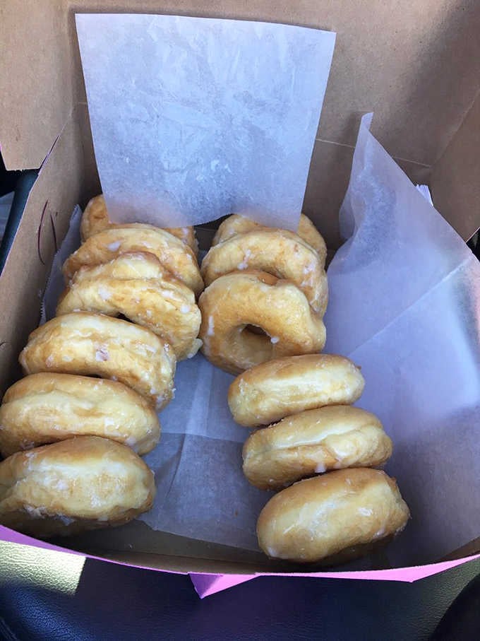 Rows of glazed donuts lined up like little golden rings of joy, simple, classic, and completely irresistible.
