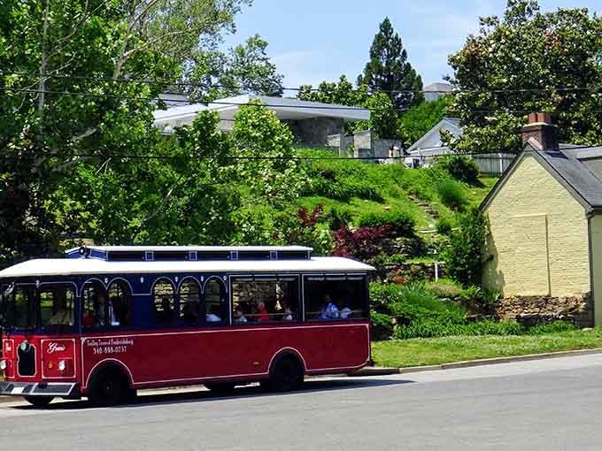 Dappled sunlight, lush green hillsides, and a cheerful trolley rolling through a quiet neighborhood street — Fredericksburg really does put on a show.