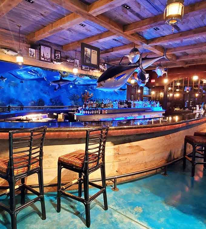 Rustic wooden beams, a curved bar glowing blue, and mounted fish overhead, this is the most dramatic place to order a drink in Texas.