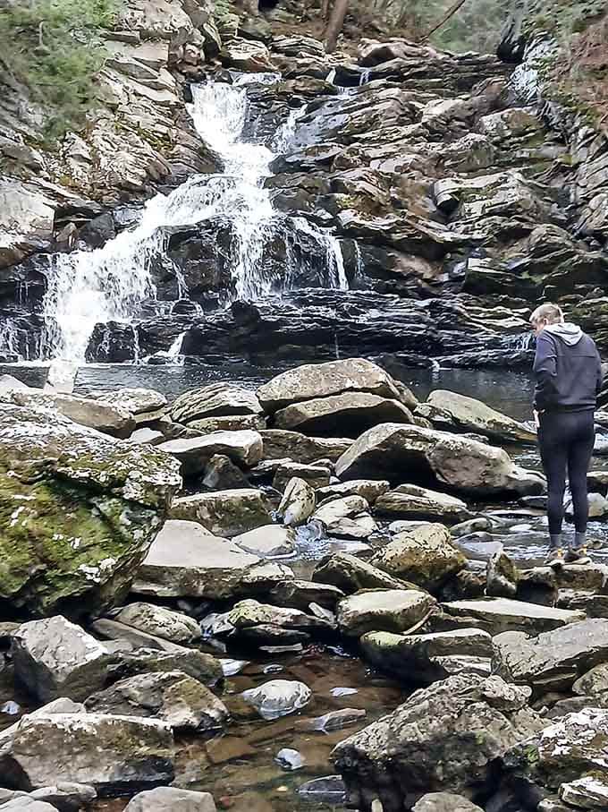 Standing before the falls, contemplating life's mysteries or just enjoying the view.
