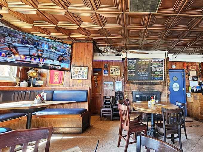 Booth seating and wooden tables create that timeless pub vibe where conversations linger longer than you planned originally.