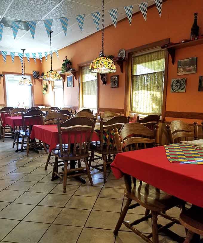 Red tablecloths, wooden chairs, and colorful patchwork runners, every detail in this dining room was chosen with warmth and purpose.