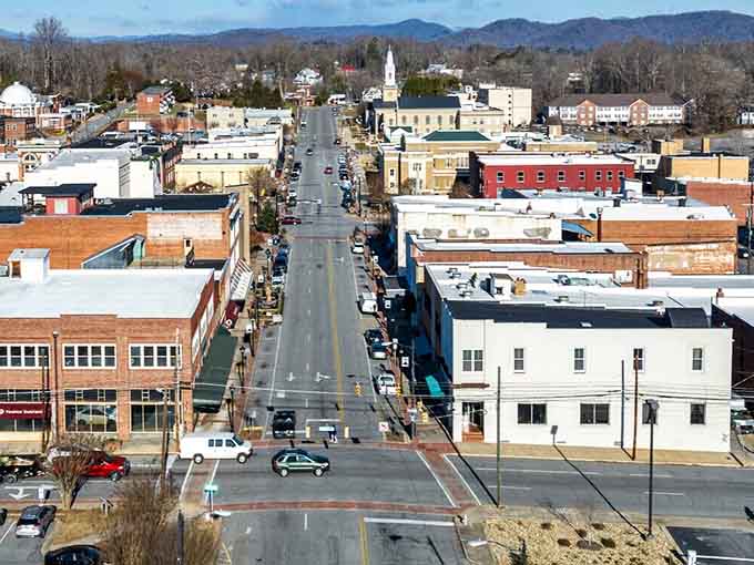 A church steeple and mountain ridgeline bookend Lenoir's main street in one of the most scenic downtown views imaginable.