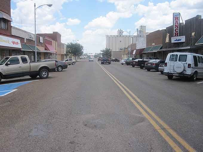 Hereford's main street stretches wide and honest, with a grain elevator standing proud at the end.