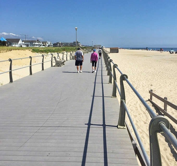 Two strollers enjoy Spring Lake's wide, peaceful boardwalk on a brilliant blue day &mdash; no arcade noise, no funnel cake lines, just bliss.