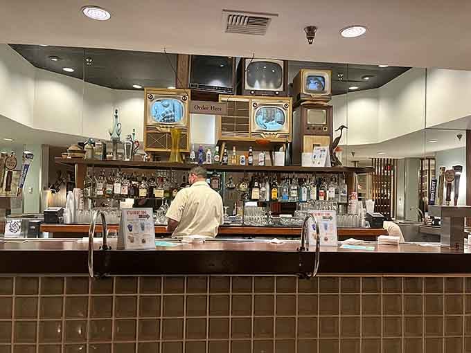 Even the bar area gets the vintage television treatment. Ordering a drink here feels like tuning into your favorite channel.