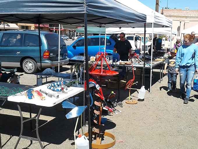 Outdoor market vendors spread their handmade wares under pop-up tents, turning a sunny parking lot into a genuine treasure hunt.