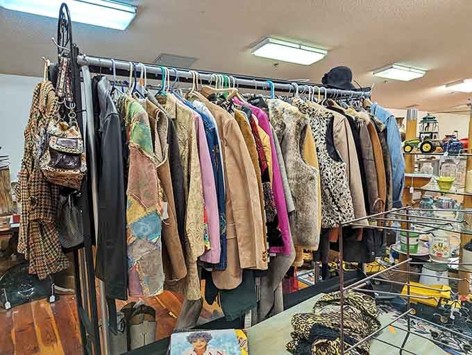 A rack of vintage coats ranging from suede to leopard print, because someone in every era knew how to make an entrance.