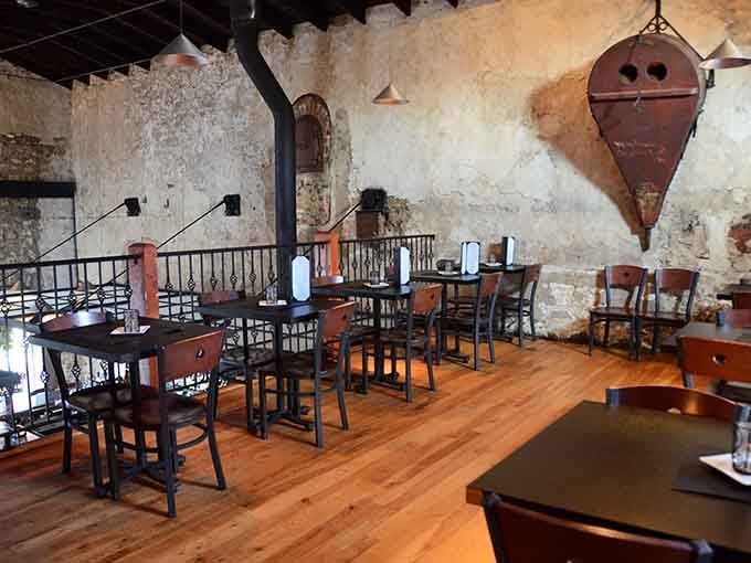 Warm wood floors, wrought iron railings, and a bird's-eye view of the dining room &mdash; the second floor at the Anvil is the best seat nobody told you about.