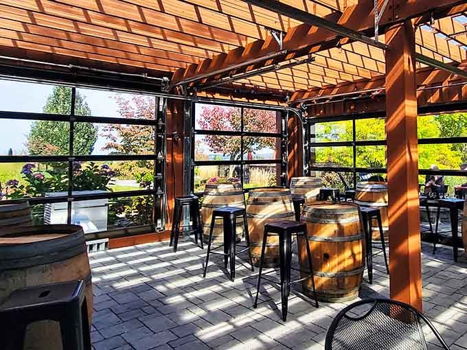 Timber pergola casting perfect shadows while you sip wine on barrels, living your best architectural digest fantasy.