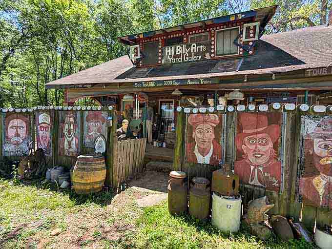 Hand-painted faces line the fence of the Hillbilly Arts Yard Gallery, greeting every visitor like old friends with stories to tell.