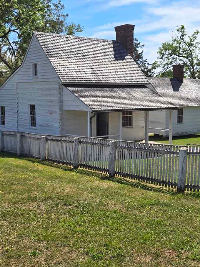 Weathered white clapboard and a sagging picket fence carry the kind of honest, unpolished character that money simply cannot manufacture.