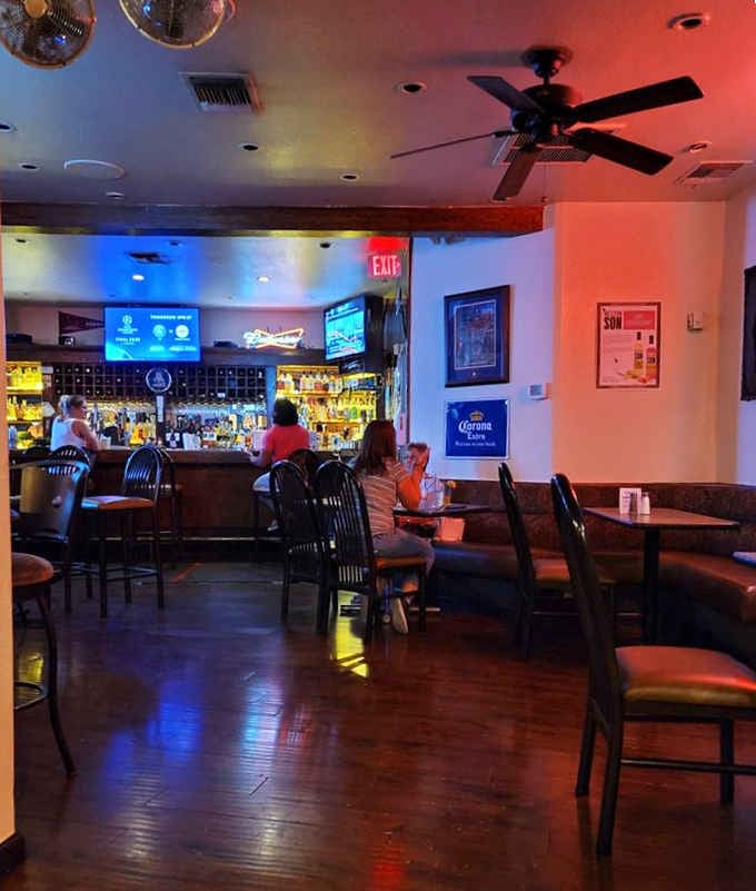 The lounge area glows with warm lighting and a well-stocked bar. A proper spot to unwind after a long Arizona day.