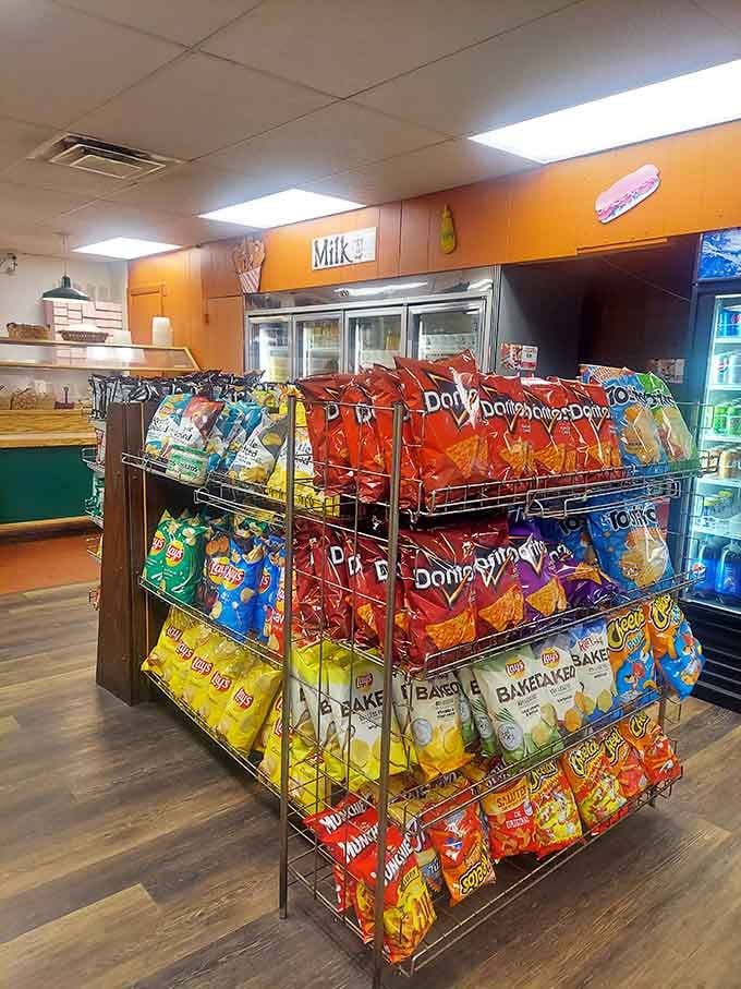 A cheerful display of snacks near the coolers, because Augusta's has everything you need for a satisfying stop, start to finish.