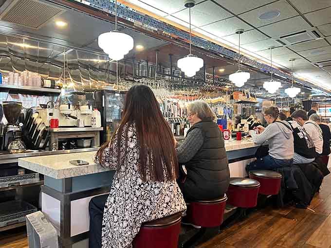 Counter seating, globe pendant lights, and the quiet hum of a diner doing exactly what it was built to do.