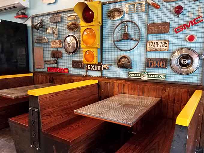 Booth seating surrounded by automotive memorabilia where you can contemplate your delicious life choices.