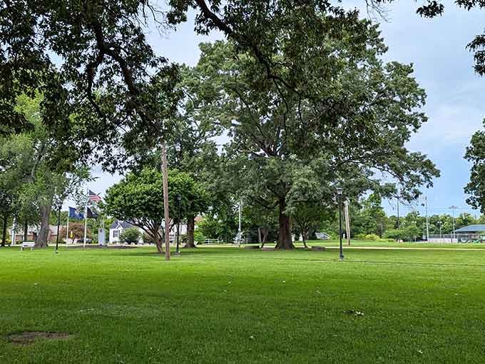 Mature trees shade expansive green lawns perfect for picnics, contemplation, or simply enjoying a slower pace.