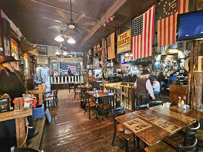 Worn wooden floors, hanging flags, and tables full of happy strangers. Big Nose Kate's interior never lets the energy drop.