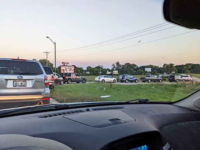 That line of cars stretching down the road is not a traffic jam. It's a queue of very smart people.