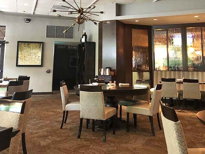 Warm wood tones, a sputnik chandelier, and a glimpse of the glowing patio beyond. Every corner tells a story.