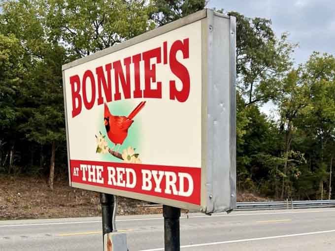 That cardinal on the sign isn't just decoration. It's a landmark, a promise, and a very good reason to pull over.