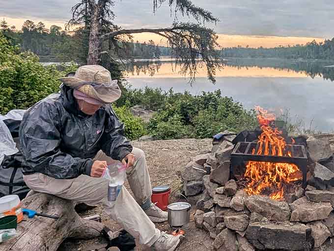 Cooking beside a steel fire grate with a glassy lake behind you is the definition of eating well.