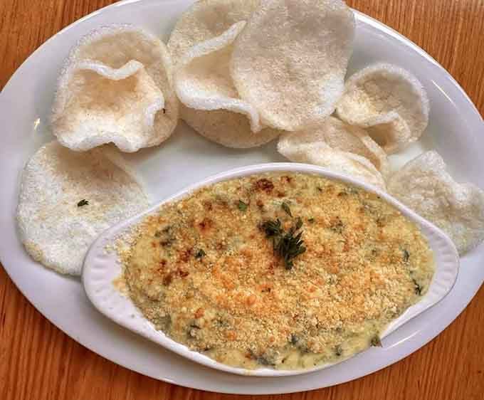 Warm, bubbling blue crab spinach and artichoke dip served with crispy chips. One scoop of this and the table goes completely, blissfully quiet.