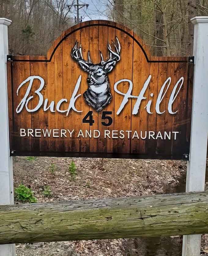 A proud wooden sign at the road's edge, announcing something worth stopping for — and it absolutely delivers on that promise.