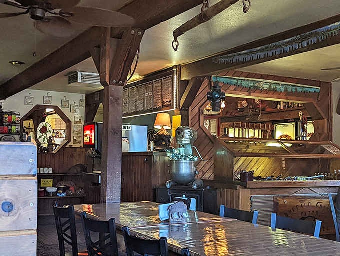 Exposed beams, antique tools on the walls, and a wood stove. This room tells a real story.