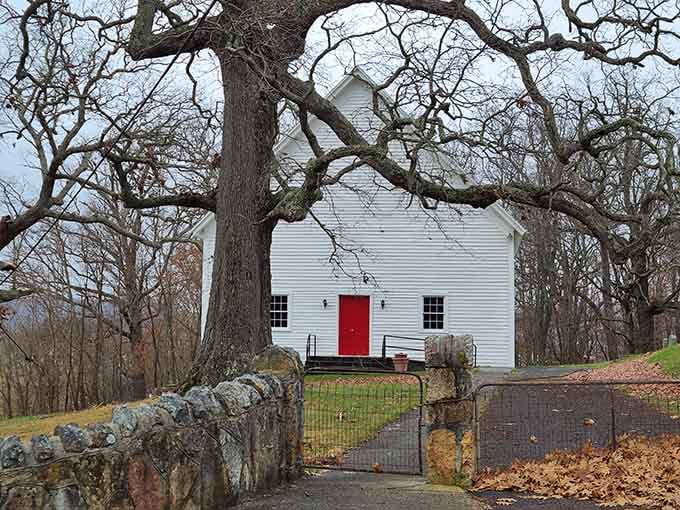 The Lutheran Church's simple white exterior and red door welcome visitors to a place where time moves more slowly.
