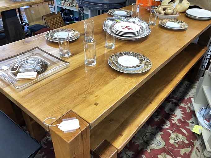 A solid wood farmhouse table set with vintage dinnerware. Your grandmother would approve, and she had excellent taste.