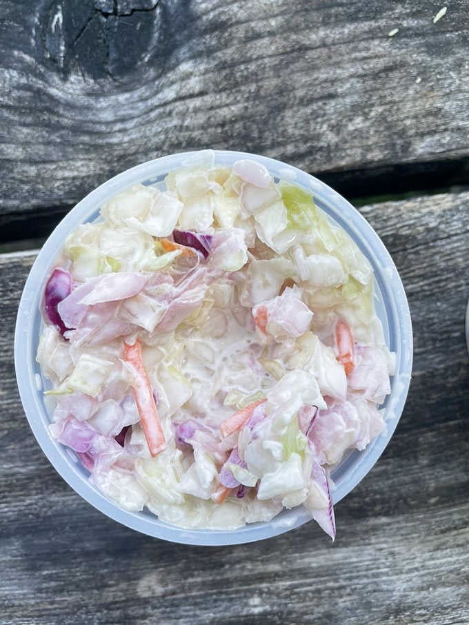 Classic coleslaw provides that cool, crunchy contrast every proper seafood plate absolutely requires for balance.