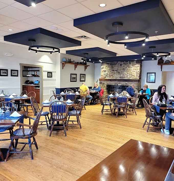 Tables filled with happy diners and that gorgeous stone fireplace create an atmosphere where every meal feels like a special occasion.