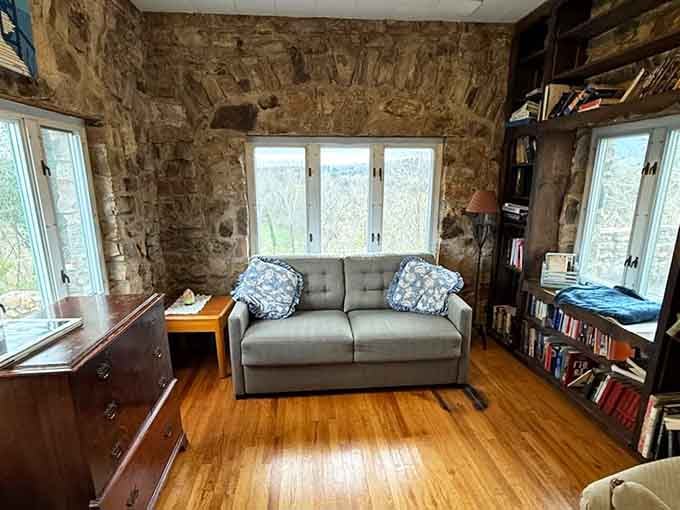 A cozy study with stone walls and bookshelves, perfect for reading or pretending you're writing important royal decrees.