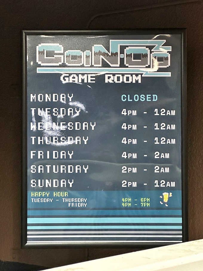 Coin-Op's hours sign tells you everything you need: closed Mondays, open late Fridays and Saturdays, happy hour Tuesday through Friday.