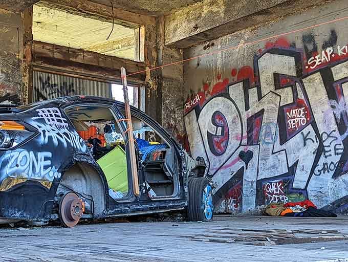 This abandoned car has become part of the installation, proving that art really is in the eye.