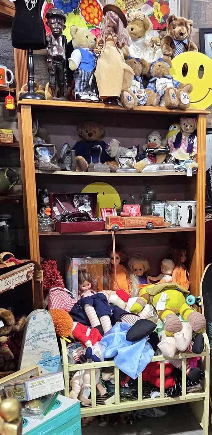Teddy bears, vintage dolls, and a tiny wooden crib that carry decades of childhood memories inside.