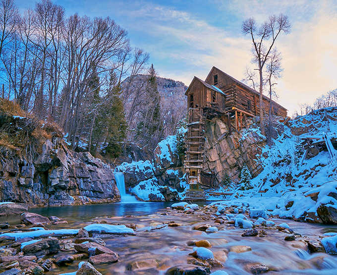 Ice and snow create a winter wonderland scene that belongs on a calendar or holiday card.