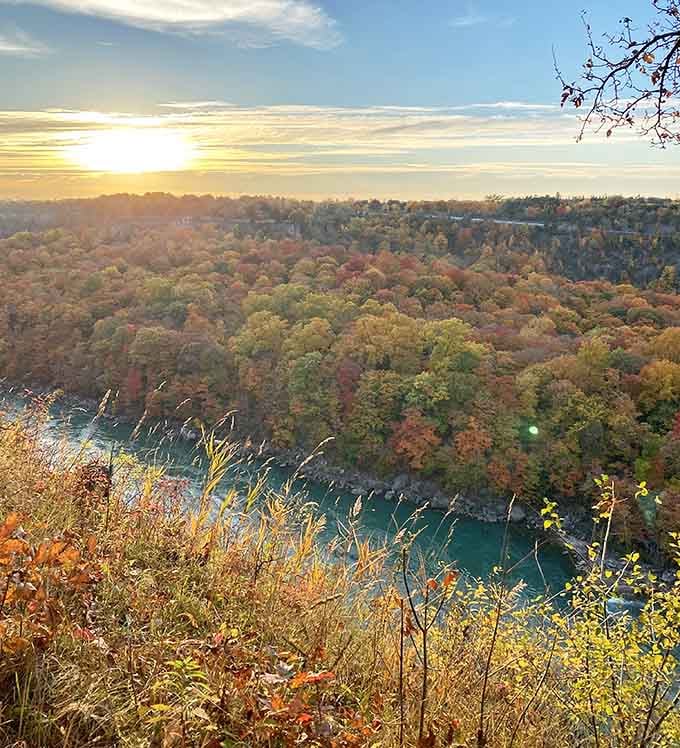 Sunset over the gorge in autumn turns the whole landscape into something that belongs in a painting, not a phone camera.